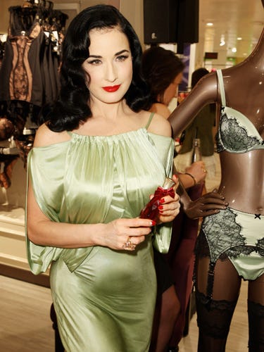 Dita Von Teese Wears Clinging Green Satin At Lingerie Launch In Germany