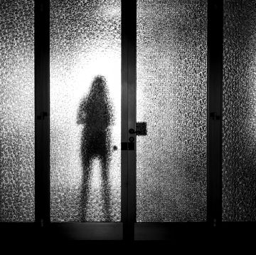 behind a glass door