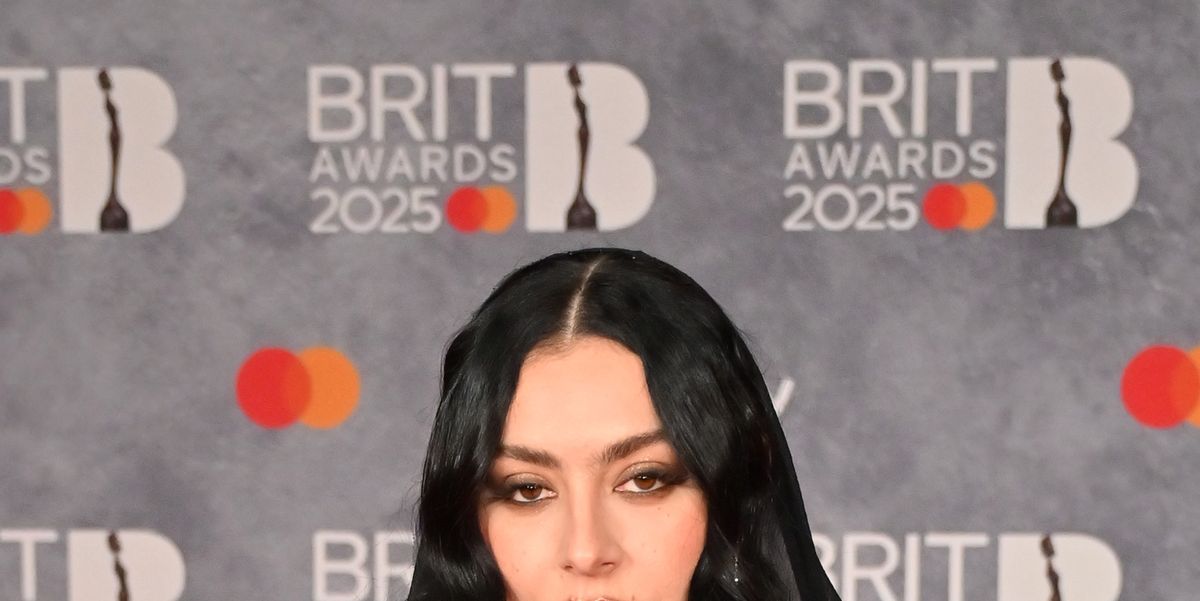 Charli Xcx Wows In Hooded Black Naked Dress At 2025 Brit Awards