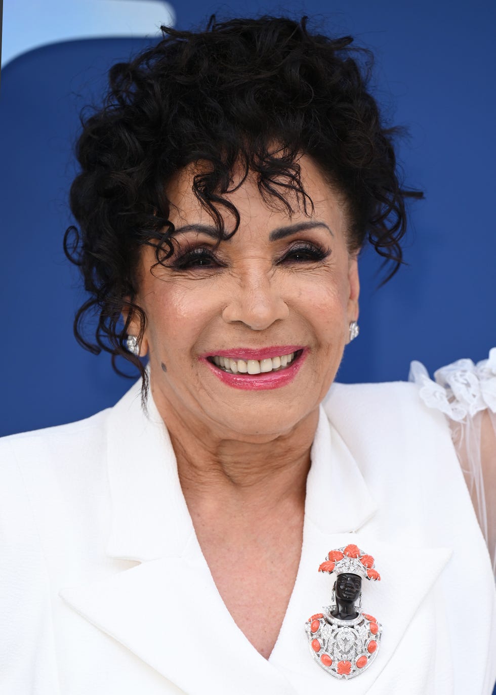Dame Shirley Bassey Wears Chic White Suit
