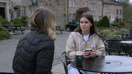 emmerdale charity dingle sarah sugden talking outside at a table