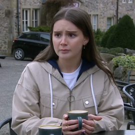 Emmerdale Charity Dingle Sarah Sugden emmerdale charity dingle sarah sugden talking outside at a table