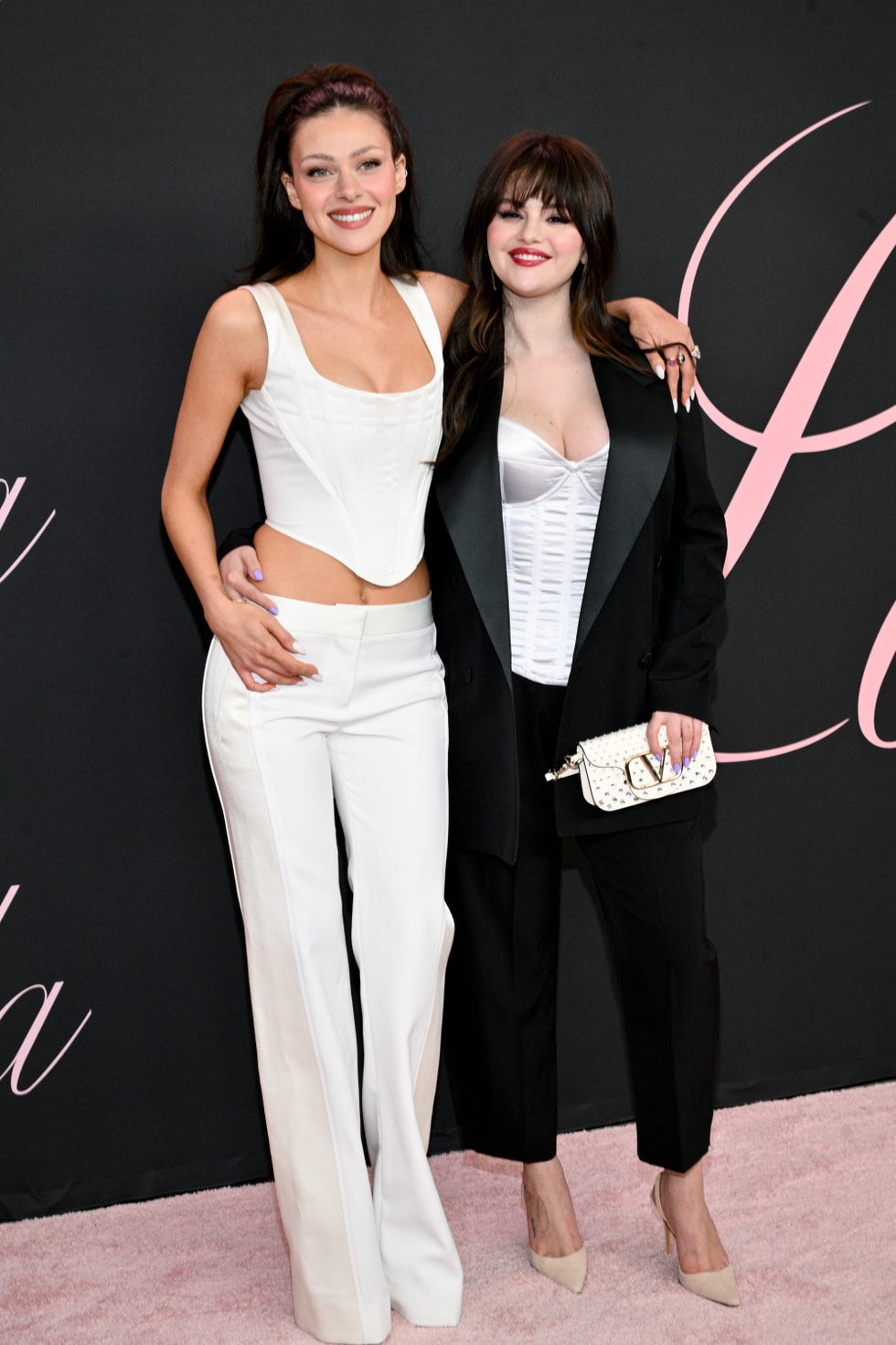 Selena Gomez And Nicola Peltz Beckham Coordinate In White Corsets
