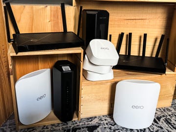several different wifi routers displayed on wooden platforms