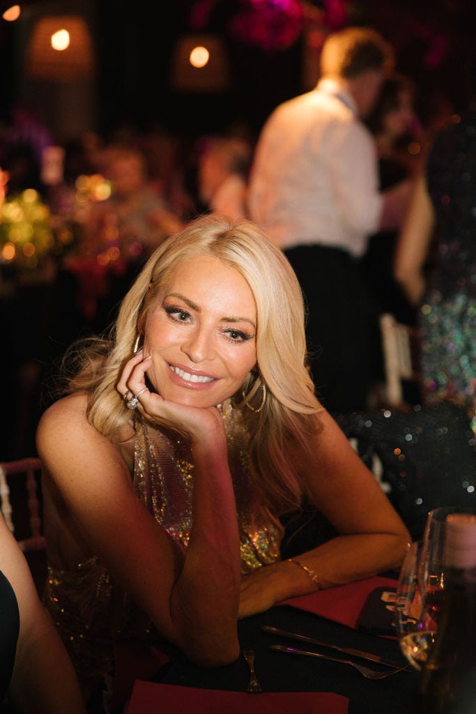 Tess Daly Reps Her Swimwear Line In A One Piece And Mesh Kaftan