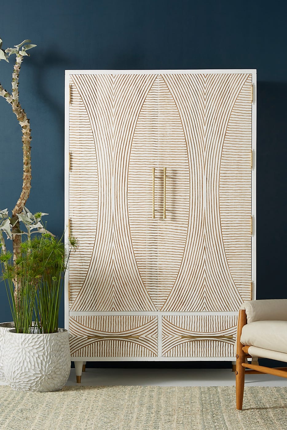 Anthropologie s Hand Carved Thalia Armoire Is The Stunning Storage You Need Stylish Armoires