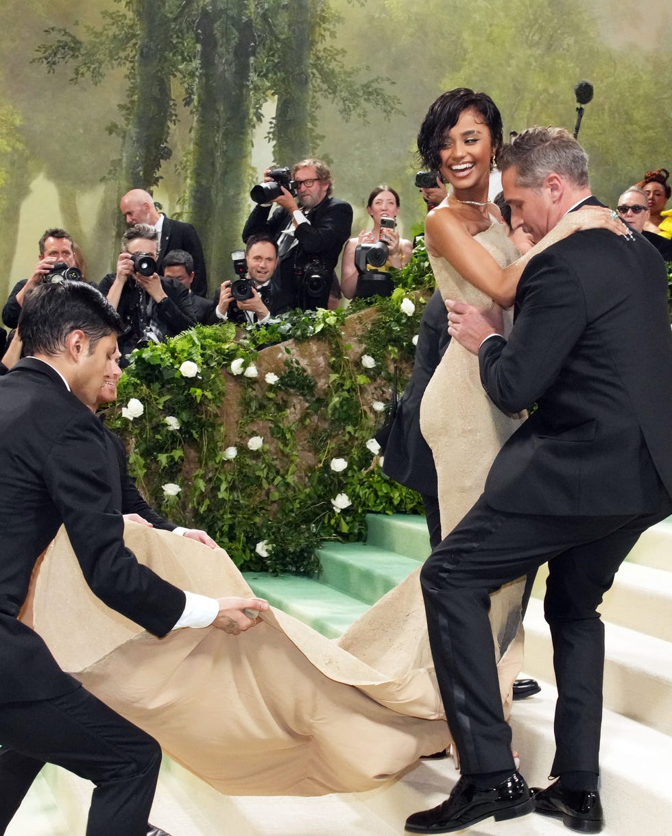 Tyla Gets Carried Up The 2024 Met Gala Steps In Her Balmain Sand Dress